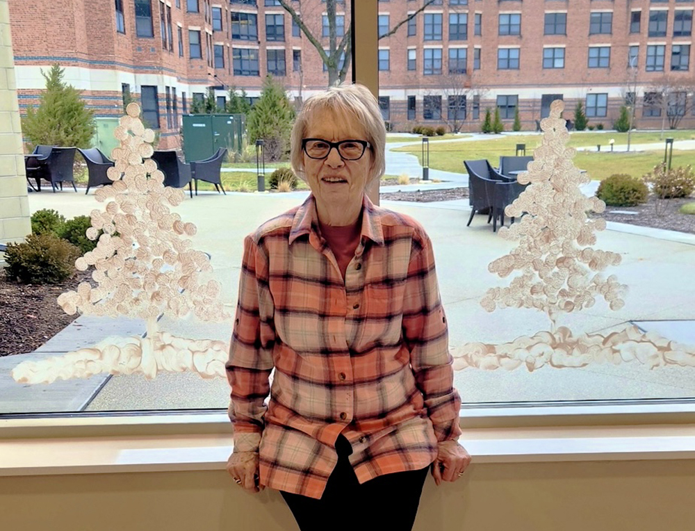 Resident Lifts Spirits With Painted Christmas Trees Throughout Oak ...